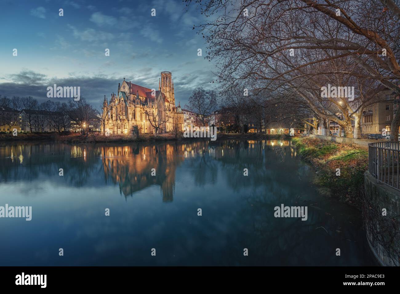 St. John's Church (Johanneskirche) and Feuersee lake at night ...