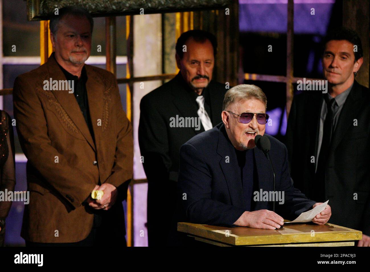 Don Wilson of The Ventures accepts the award as the band is inducted ...