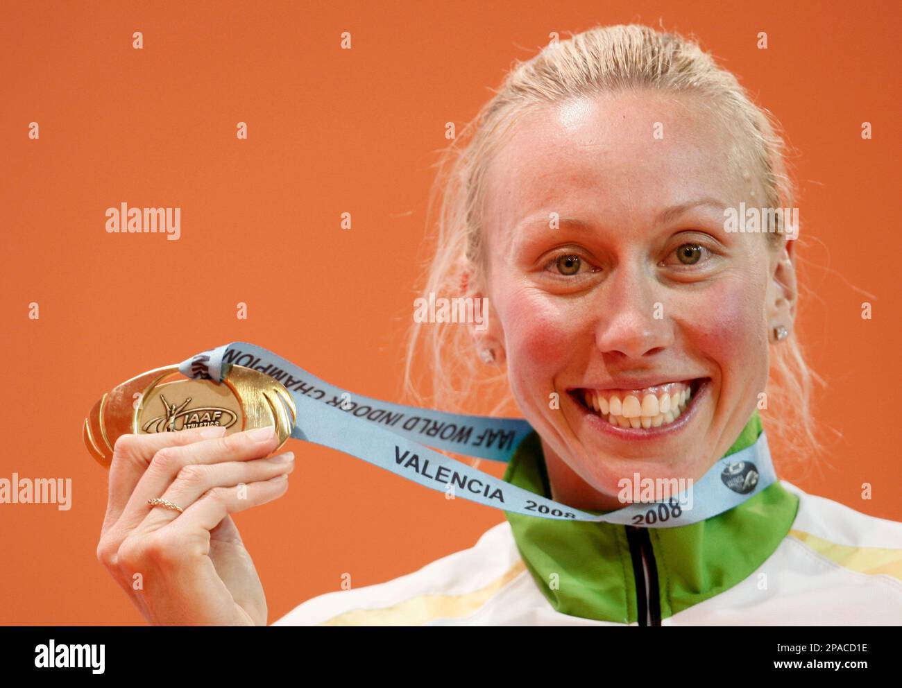 Australia's Tamsyn Lewis displays her gold medal during the victory ...