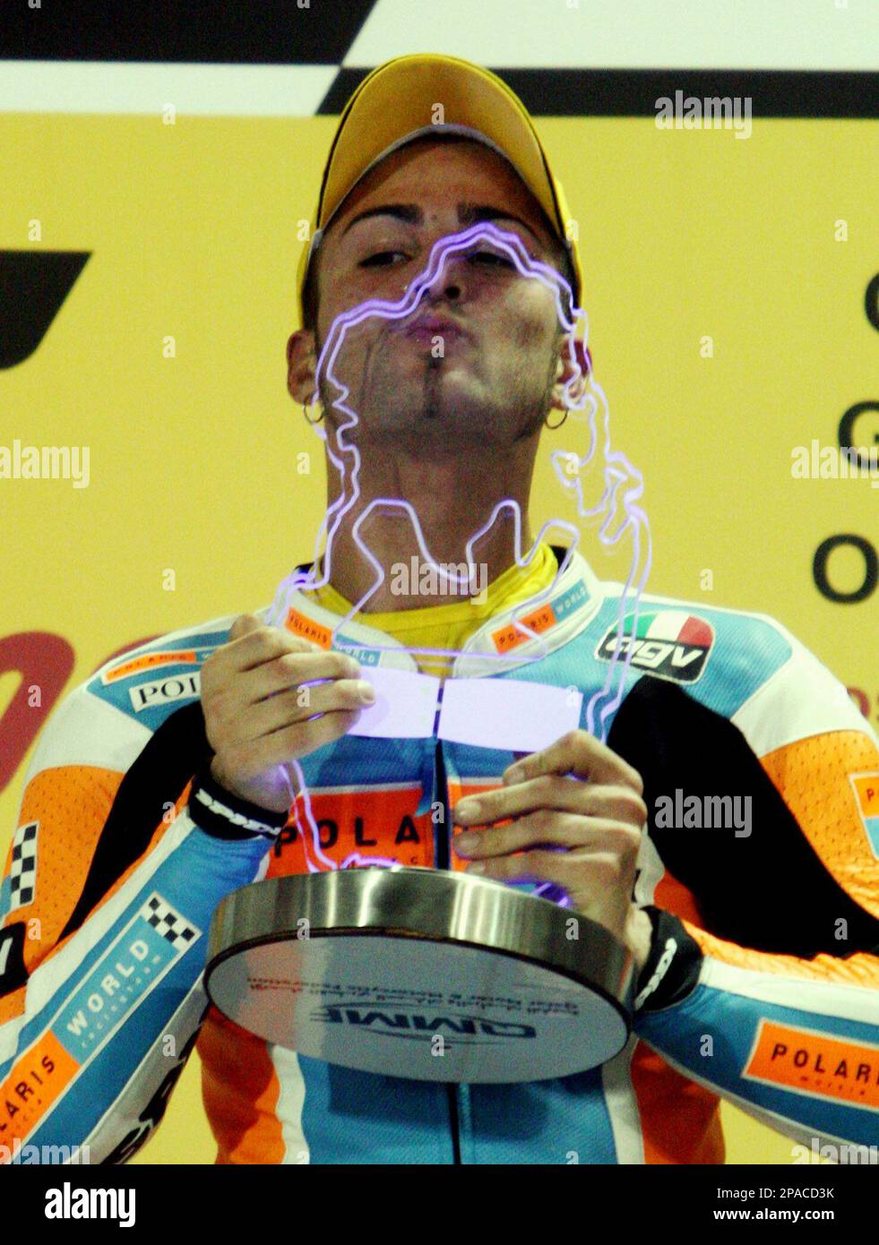 Italia's Mattia Pasini kisses his trophy after he won the race in the ...