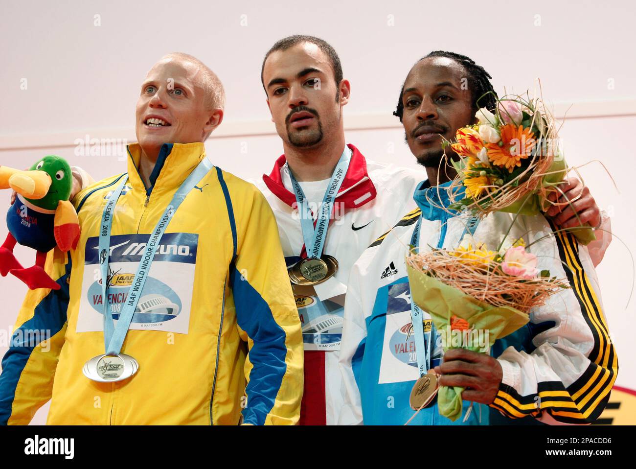Canada's gold medal winner Tyler Christopher, center, is flanked by ...