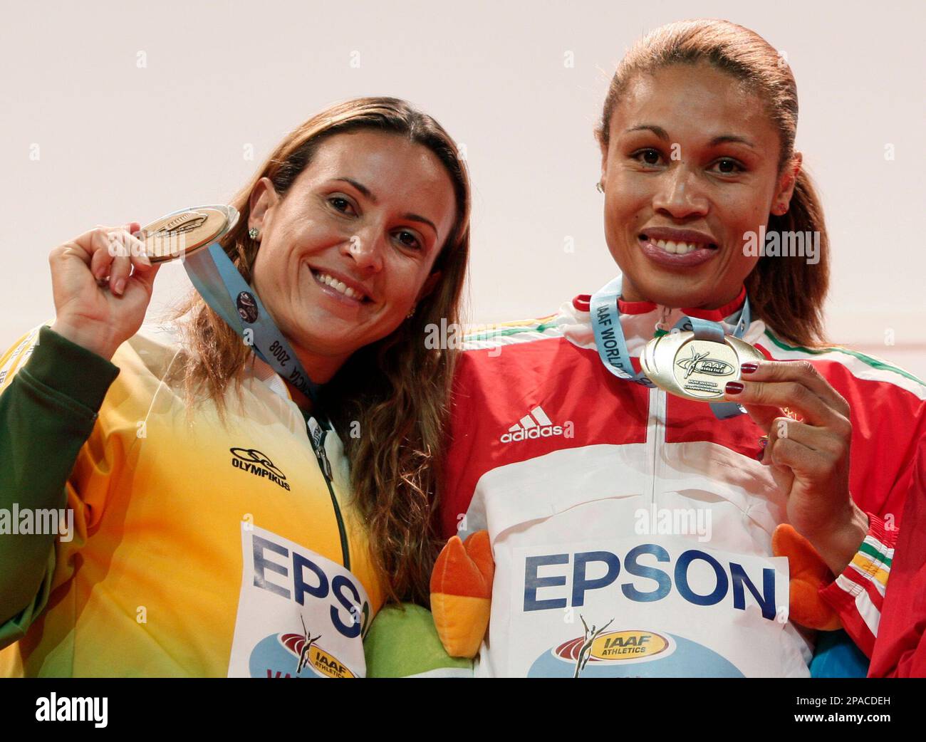 Portugal's gold medal winner Naide Gomes, right, and silver medal ...