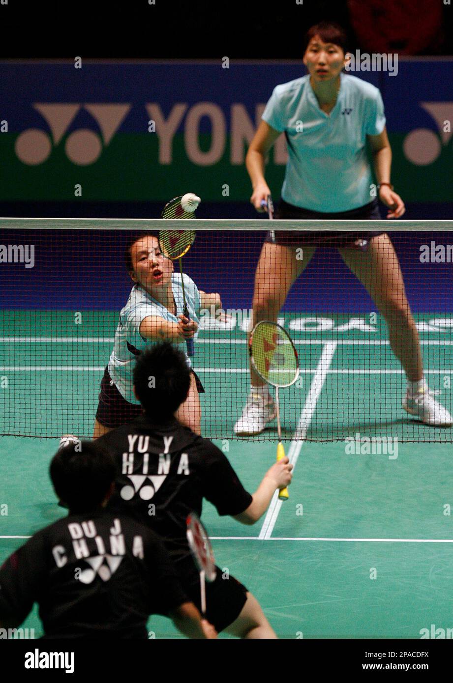 South Korea's Lee Kyung Won, top left, takes a shot while her partner ...