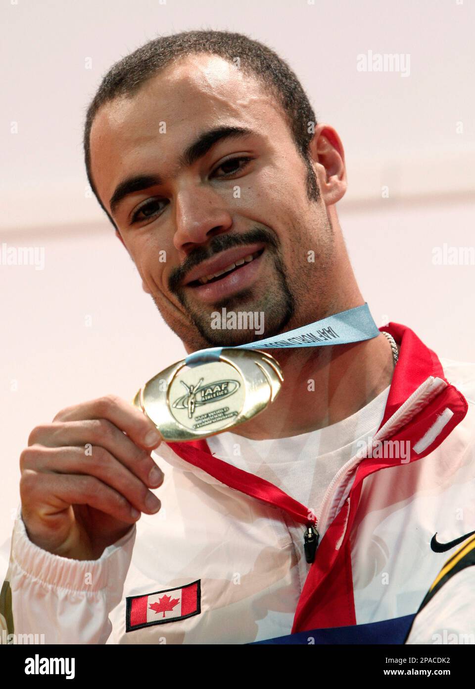 Canada's Tyler Christopher displays his gold medal during victory ...
