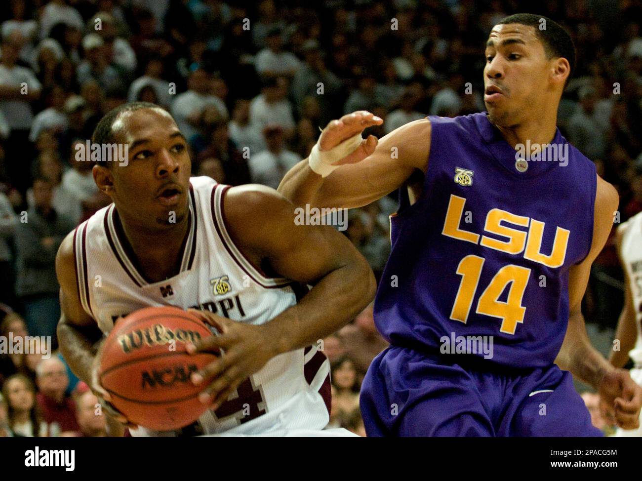 Mississippi State guard Jamont Gordon, left, looks for an open pass as ...
