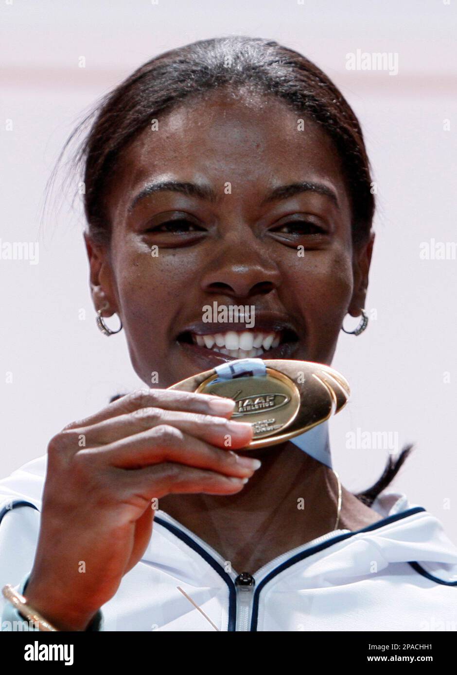 United States' Angela Williams displays her gold medal during the medal ...