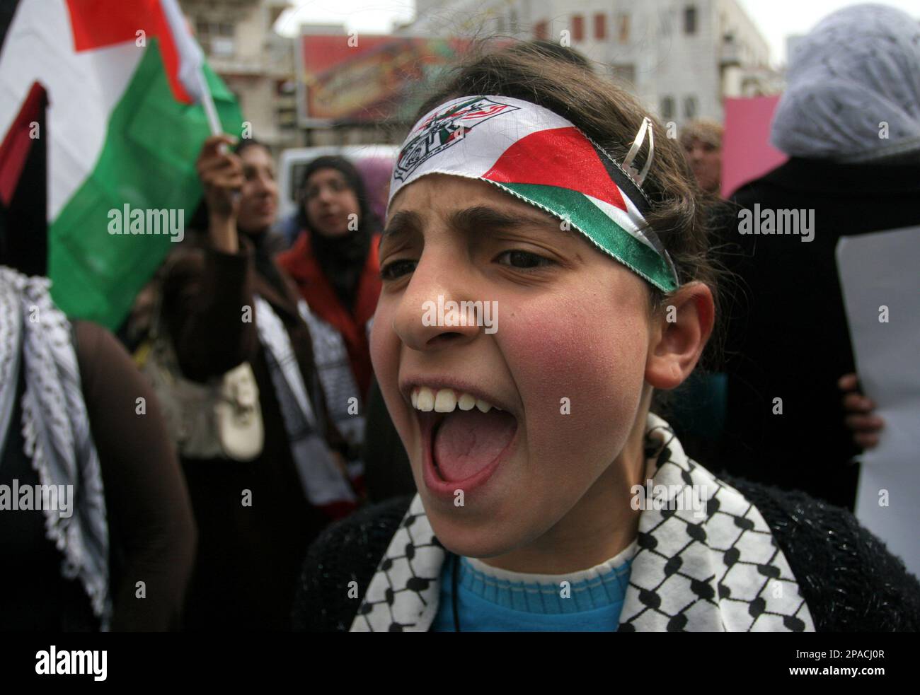 A Palestinian girls shouts slogans during a rally marking International ...