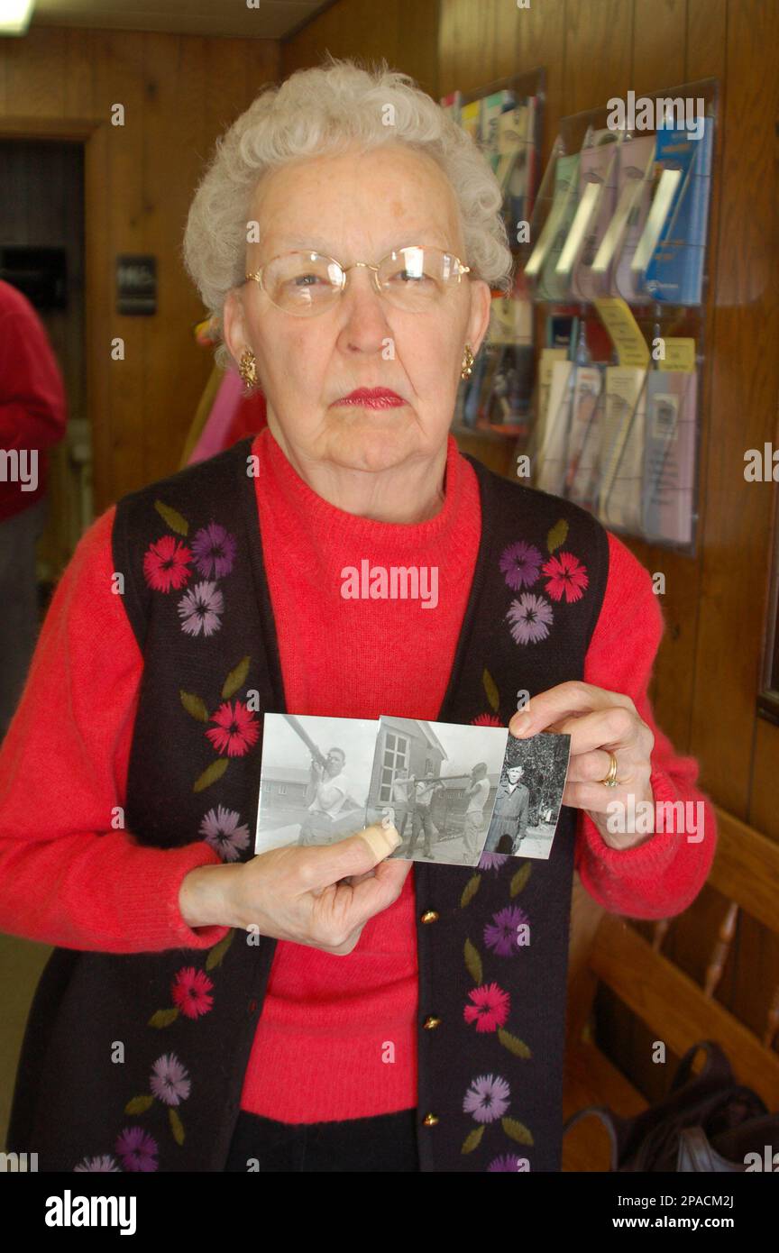 Rose Moore of Doran, MInn., holds up military pictures of her brother ...