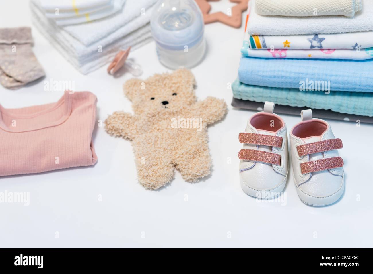 Concept of giving birth. Set of clothes and accessories for newborn on ...