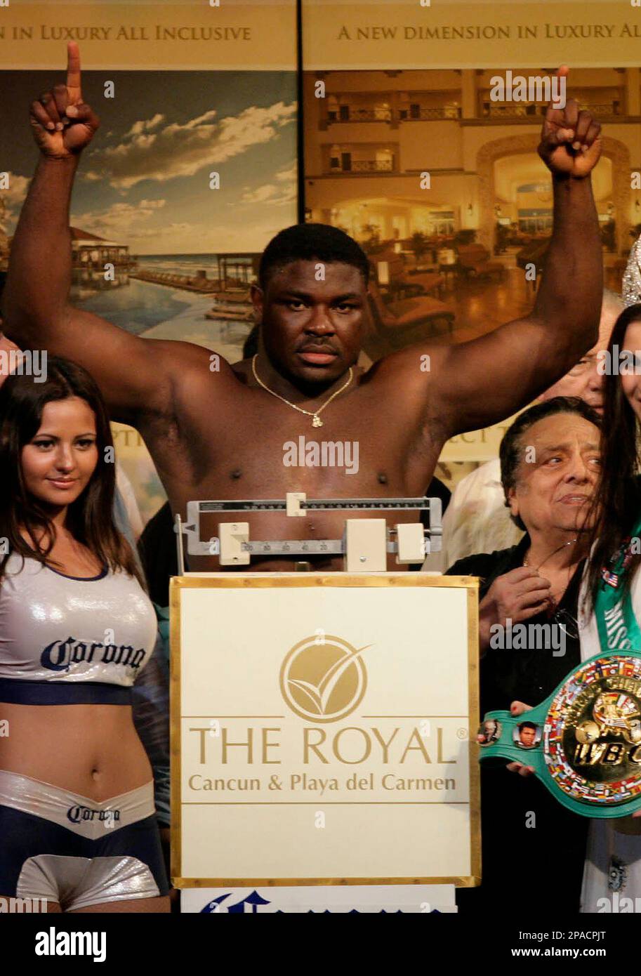 Professional boxer Samuel Peter, center, of Nigeria, poses for pictures ...