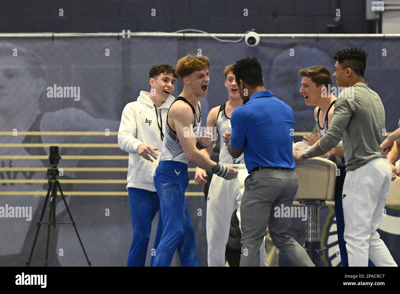 Air Force gymnast Patrick Hoopes, second from left, celebrates with his ...