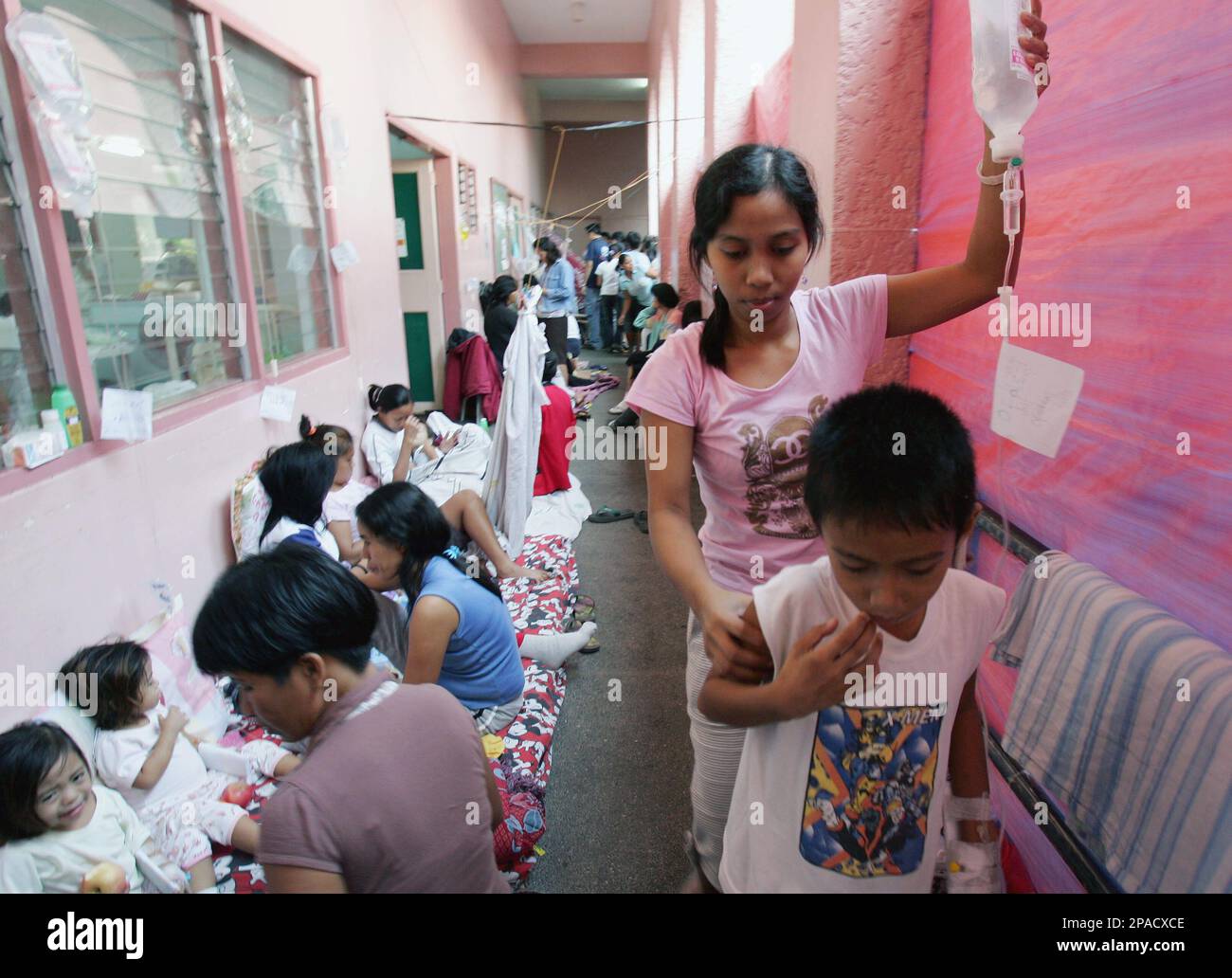 Filipino patients, mostly children, recuperate along the corridors of ...