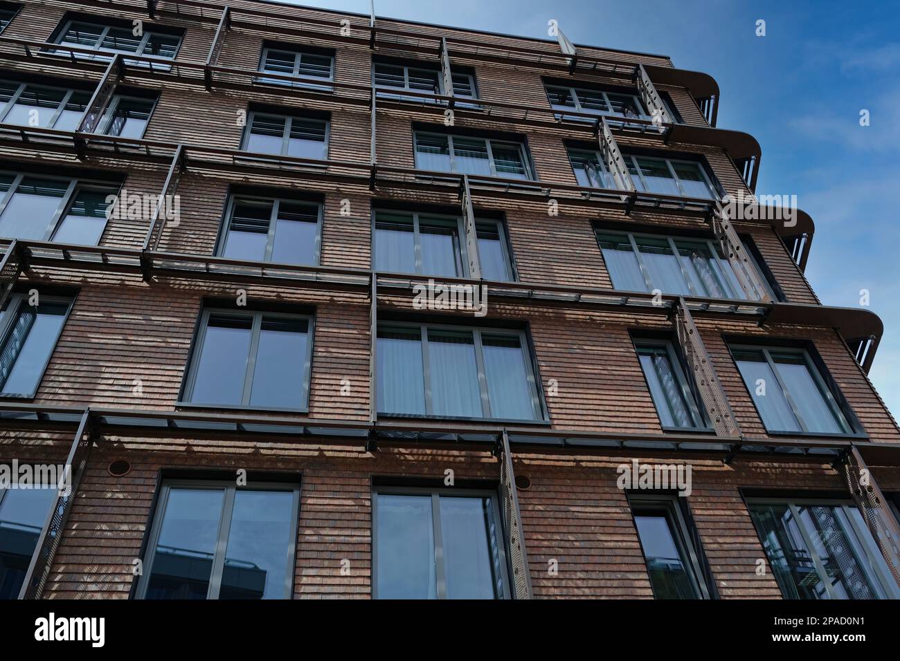 Exterior of modern red brick house with metal inserts. Architectural ...