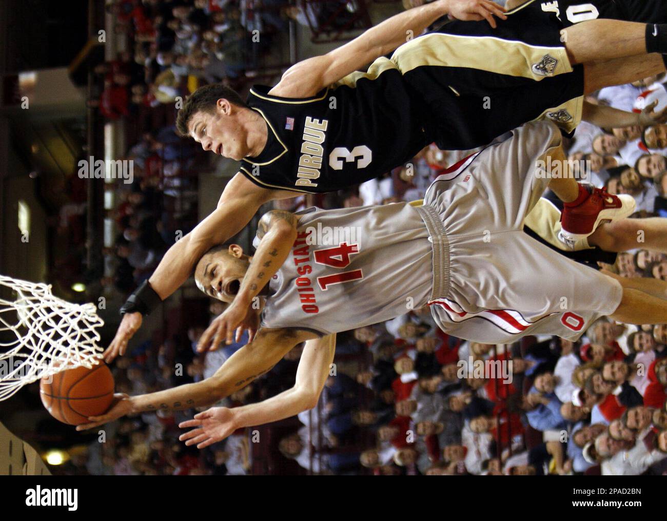 Ohio State's Jamar Butler (14) is fouled as he goes to the basket by ...