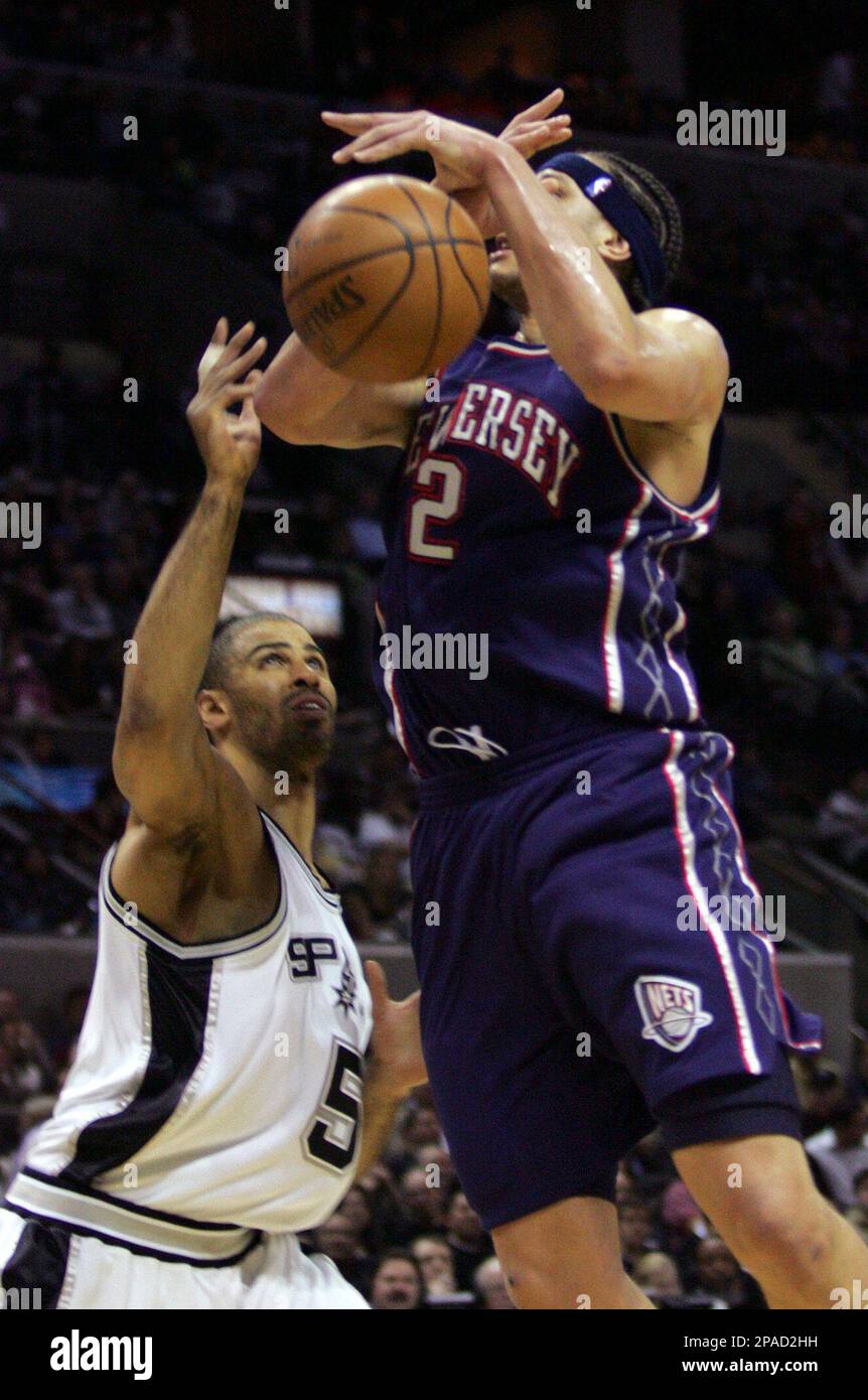 New Jersey Nets' Josh Boone, right, is fouled by San Antonio Spurs' Ime ...