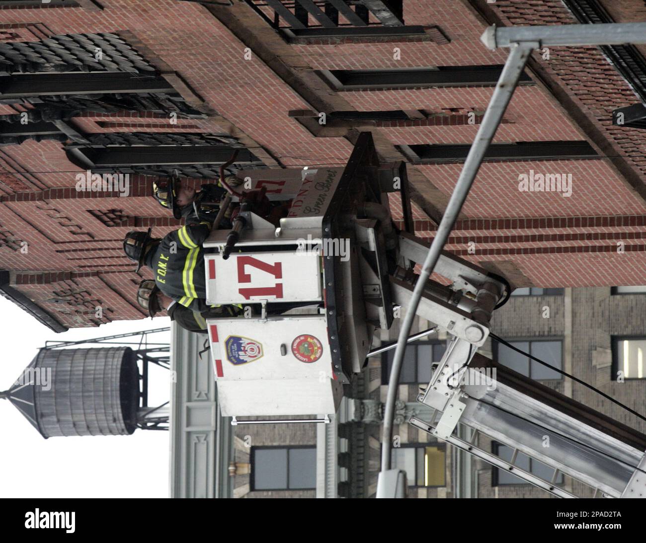 Emergency services check the other side of a building collapse on 124 ...