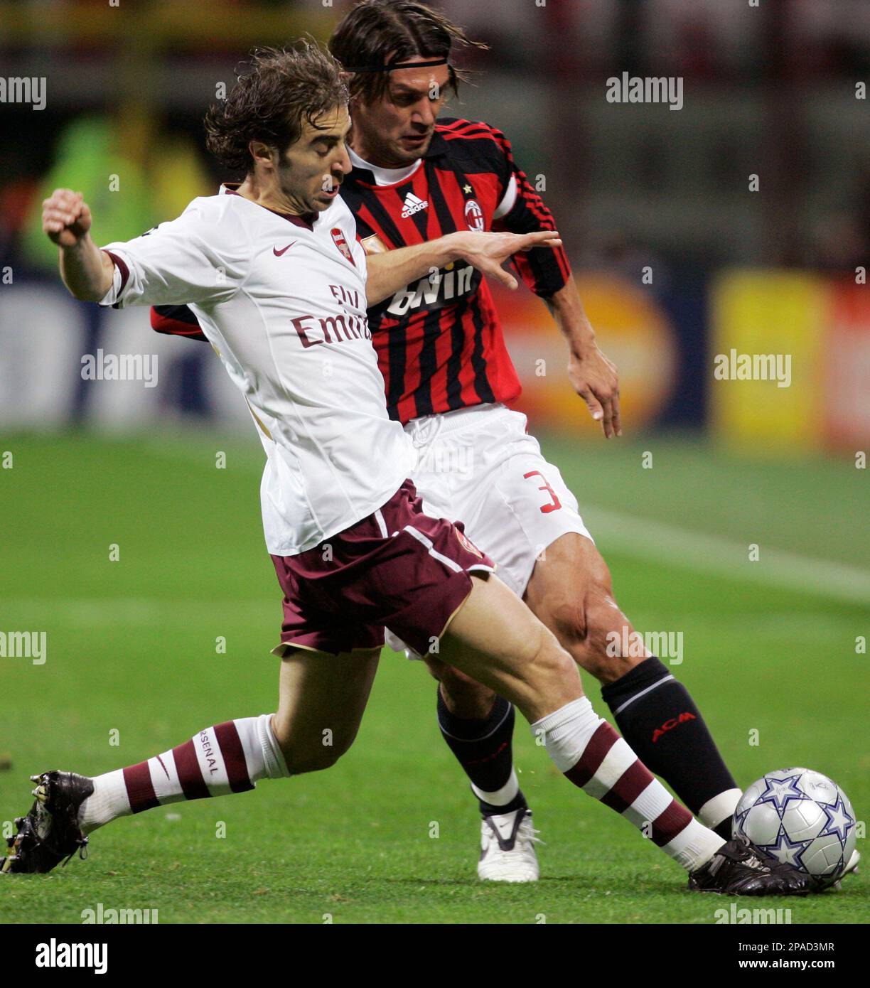 AC Milan defender Paolo Maldini, right, and Arsenal French midfielder ...