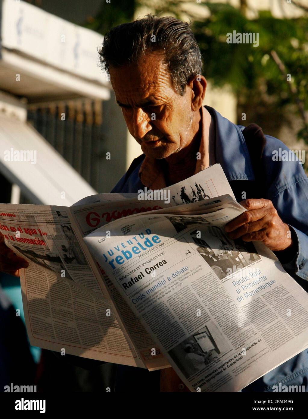 A man reads the latest edition of Cuba's Granma newspaper in Havana ...