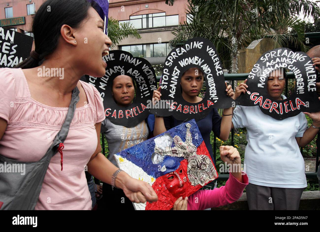 Protesters hold a brief rally across the U.S. Embassy in Manila ...