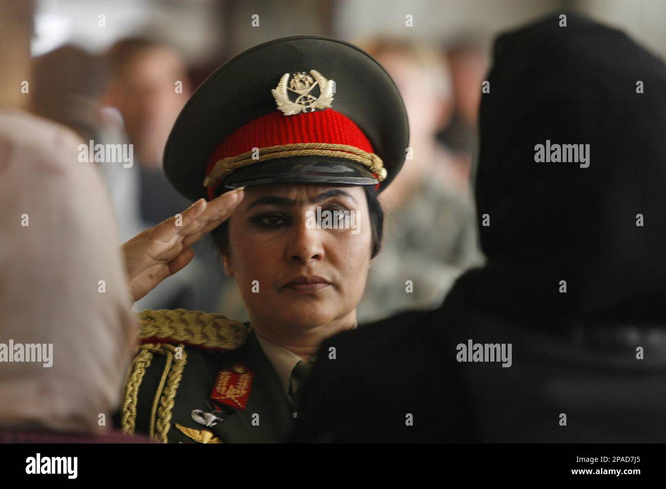 Gen. Khatol Mohammadzai salutes as U.S. national Anthem rings out to ...