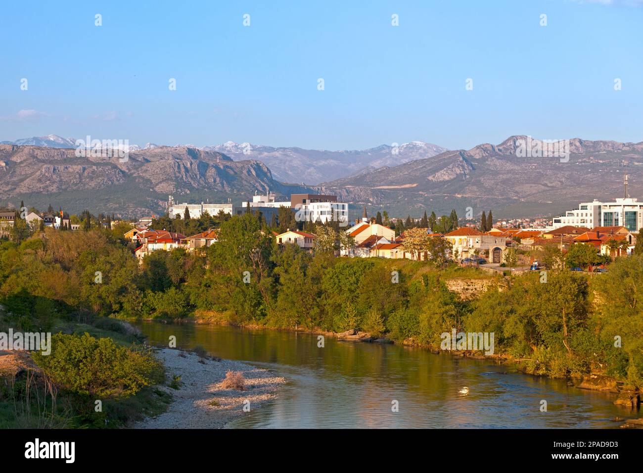 Podgorica, Montenegro - April 20 2019: The Morača river with behind ...