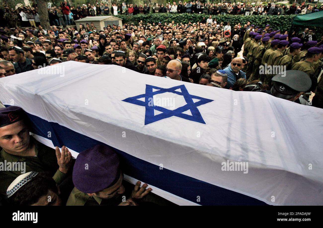 Israeli soldiers carry the flag-drapped coffin of Staff Sergeant Eran ...