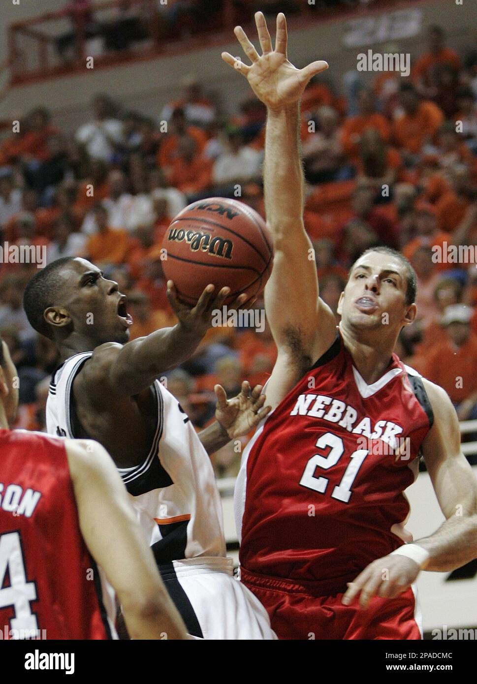 Oklahoma State guard Terrel Harris, left, goes up for a shot as ...