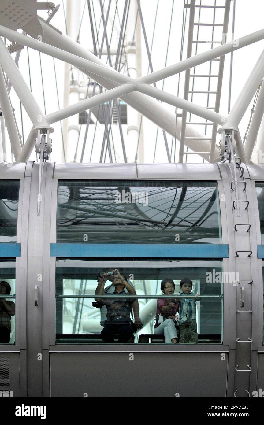 A family looks out from one of the capsules on the world's biggest ...