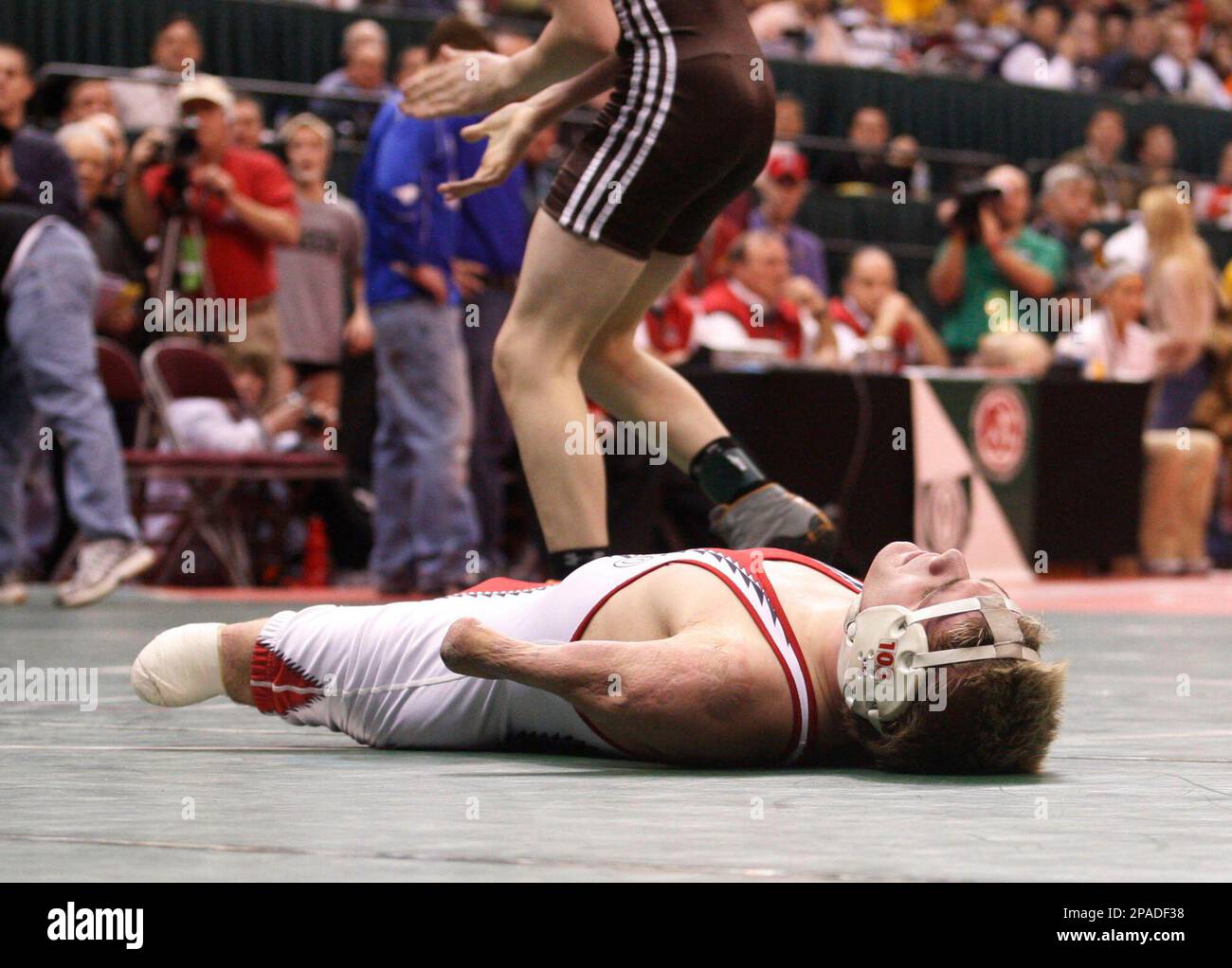 Hillsboro's Dustin Carter lies on the mat after his 5-1 loss to Parma ...