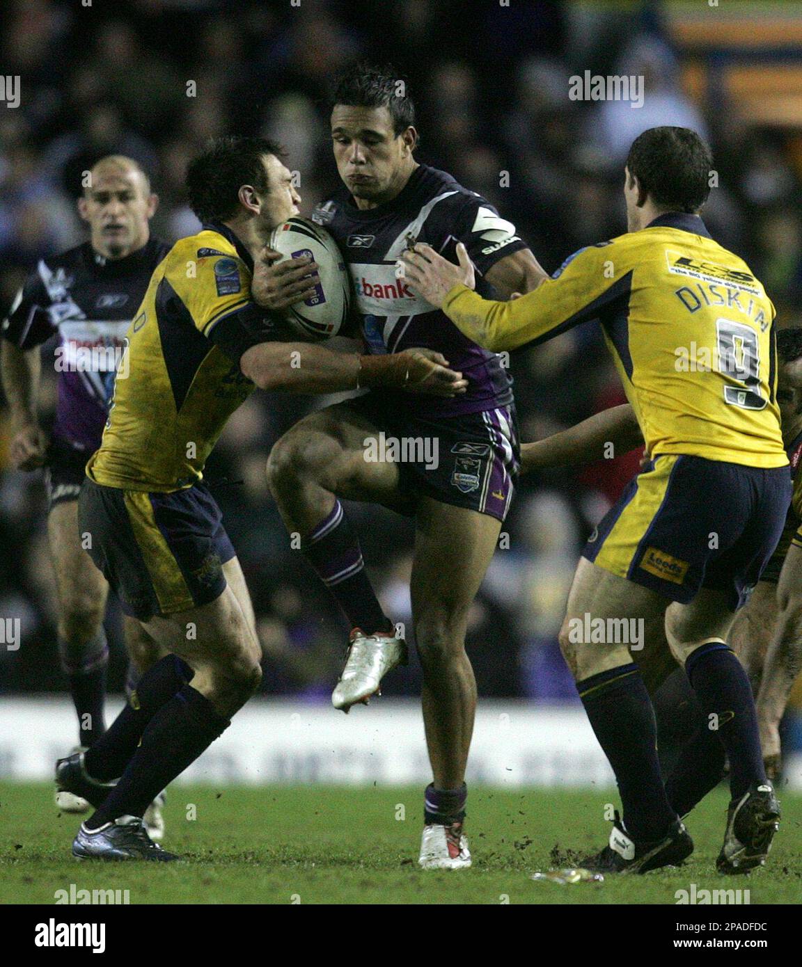 Leeds Rhinos Kevin Sinfield, left and Matt Diskin, right, tackle ...