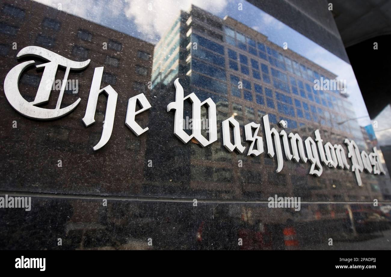 The Washington Post sign is seen on its building in Washington ...