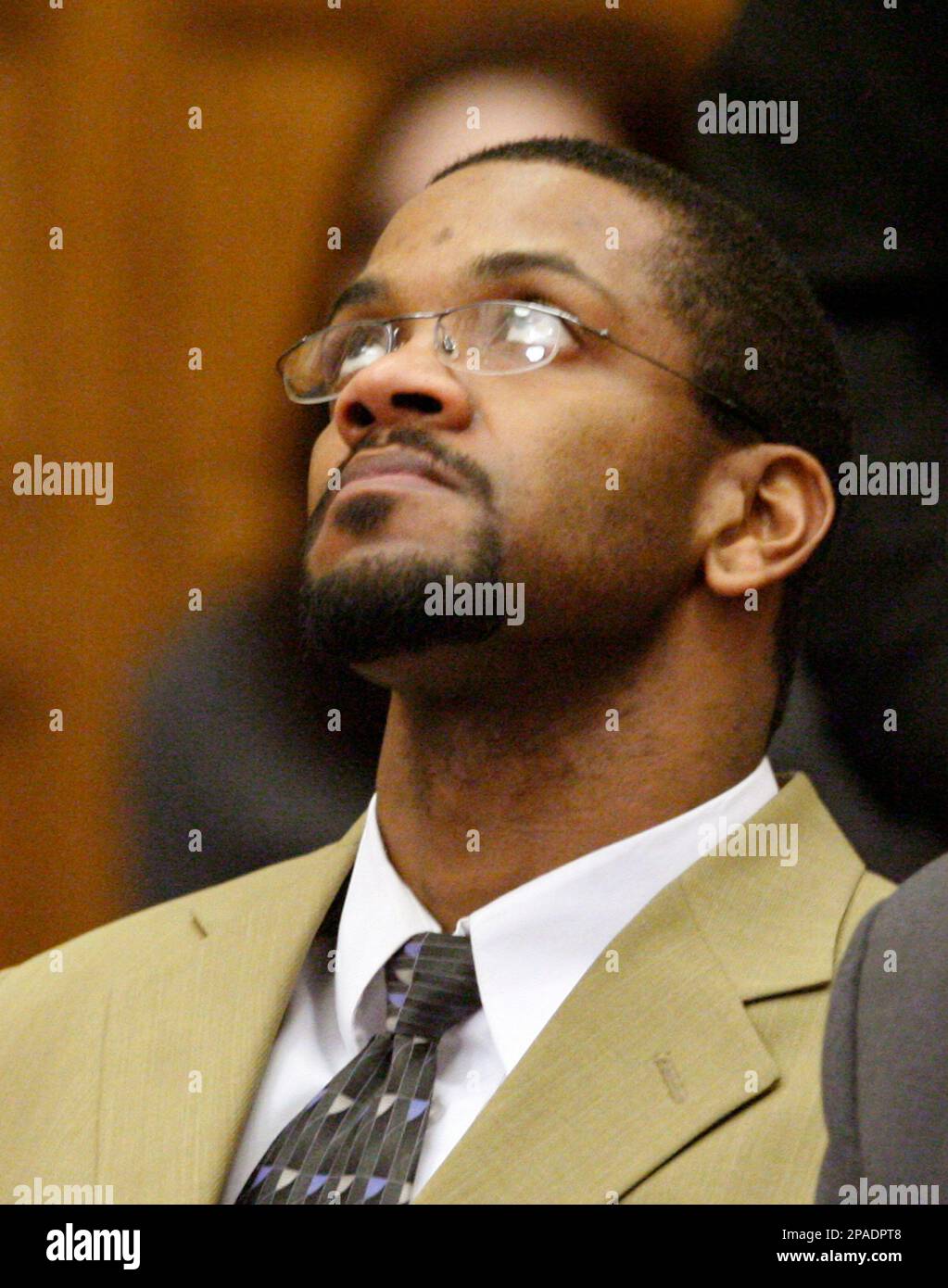 Former Canton police officer Bobby Cutts Jr. looks up as he listens to ...