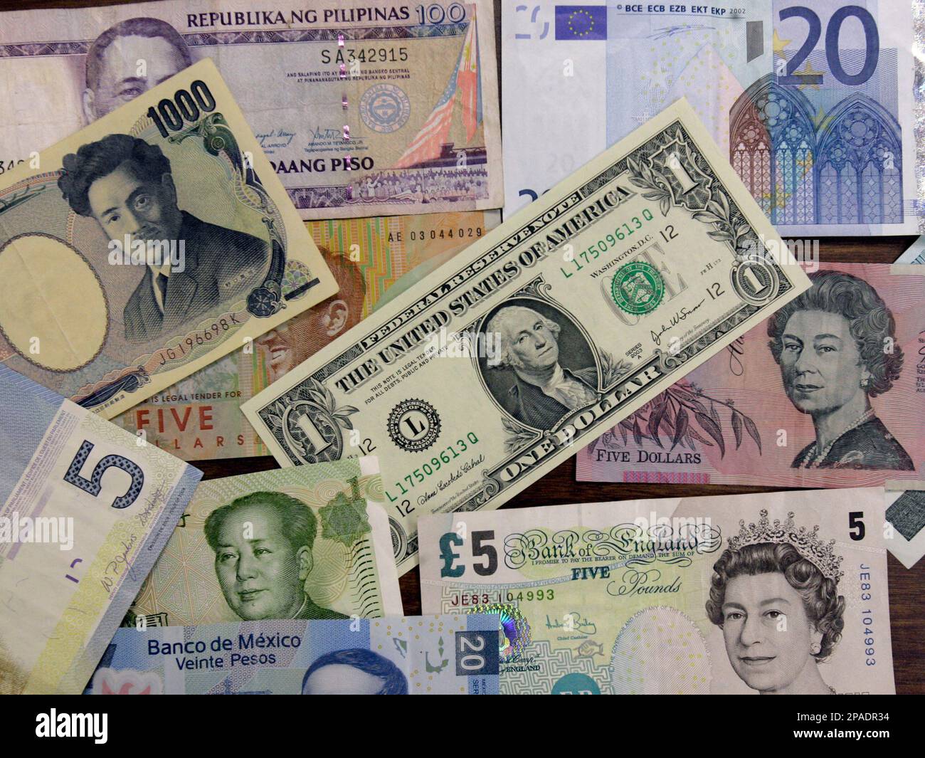 A U.S. one dollar note is seen among other foreign currencies at ...