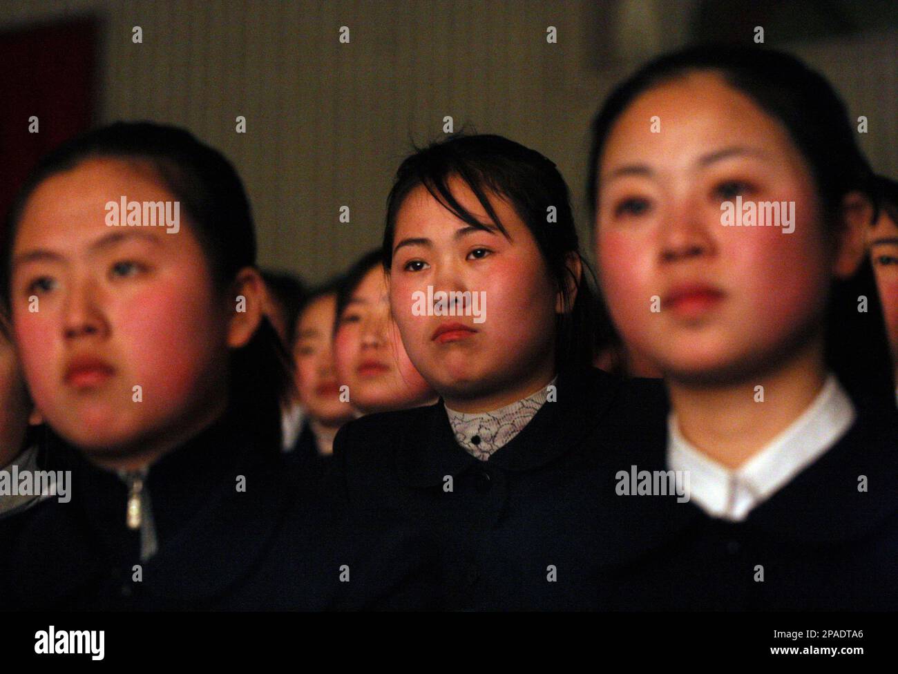 North Korean girls listen to a performance in English and Korean of the ...
