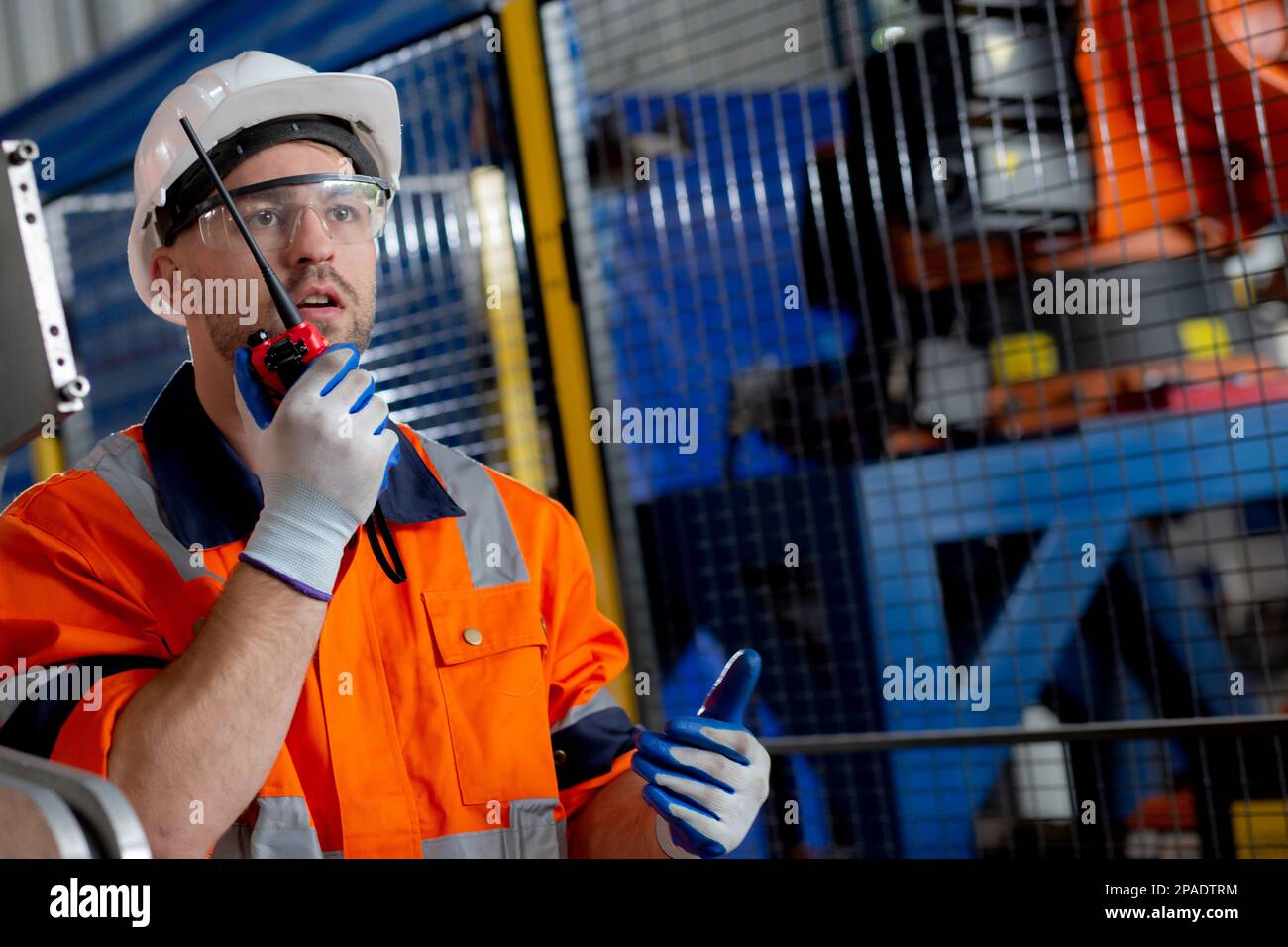 Young caucasian engineer man inspection robot arms technology ...