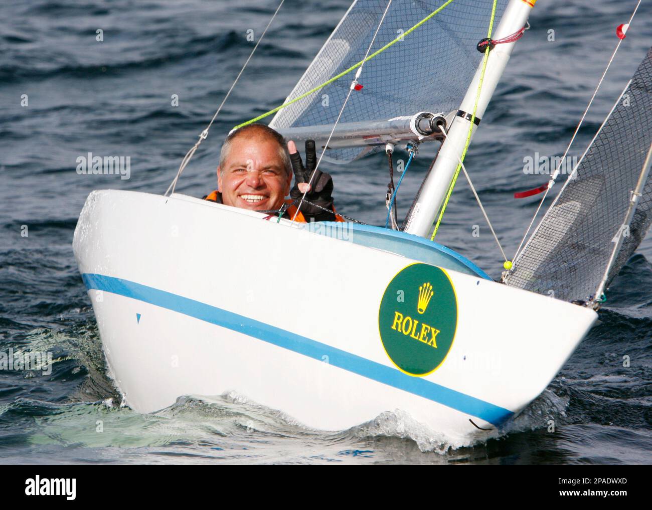 John Ruf gives the victory sign while competing in his 2.4 meter boat ...