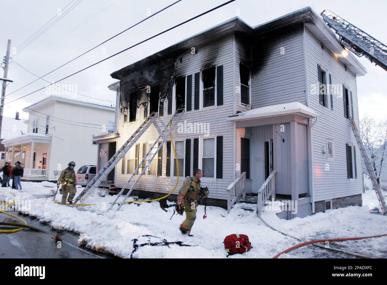 **APN ADVANCE FOR SUNDAY MARCH 2** Firefighters walk around the scene ...