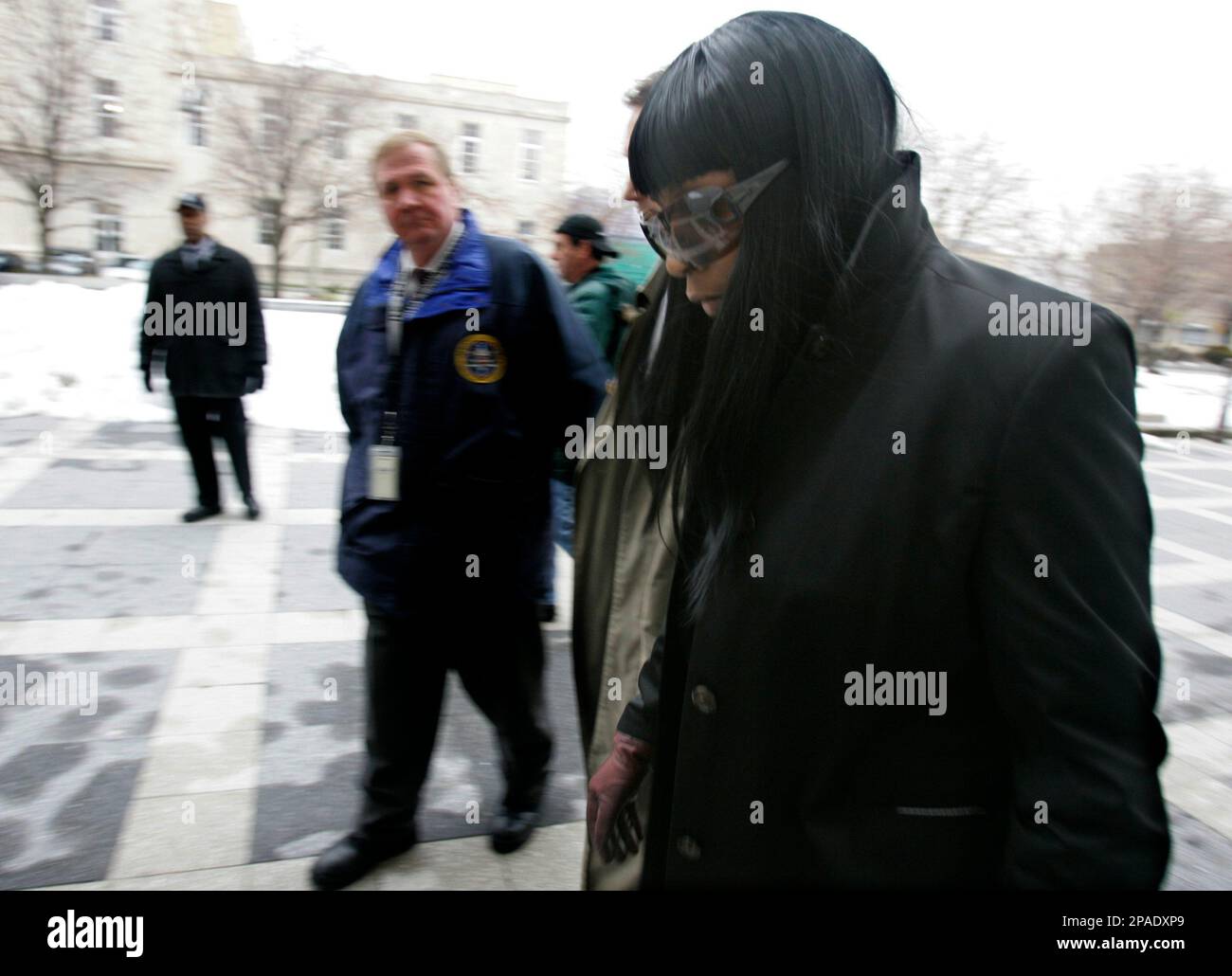 Tamika Riley, right, arrives at the U.S. District Courthouse in Newark ...