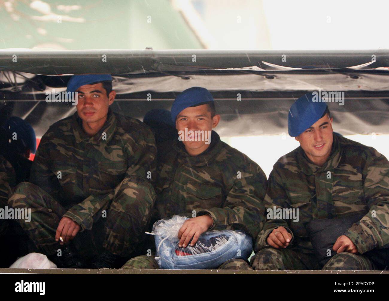 Turkish army commandos are seen seated on the back of a vehicle which ...