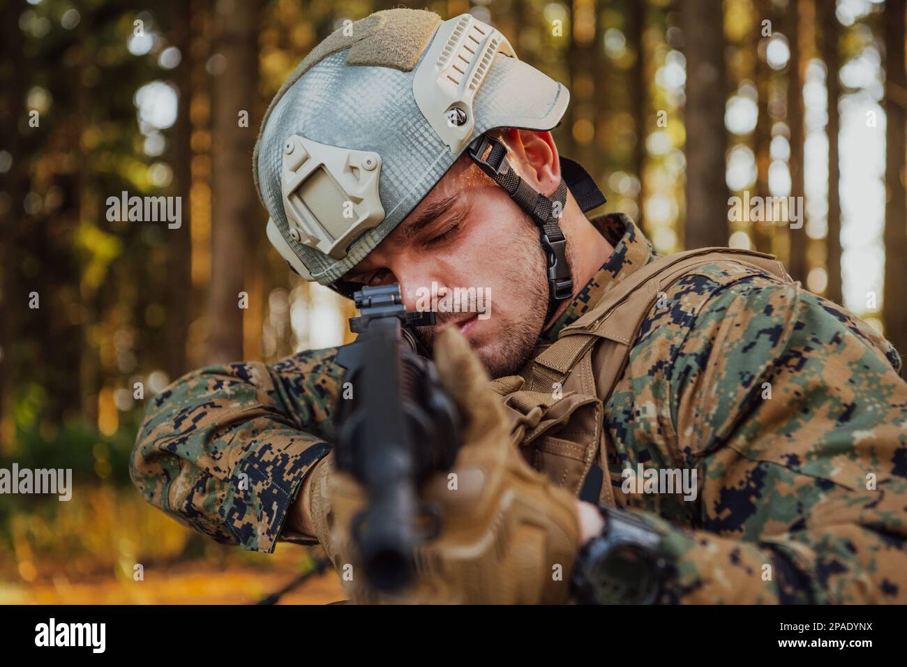 A modern warfare soldier on war duty in dense and dangerous forest ...