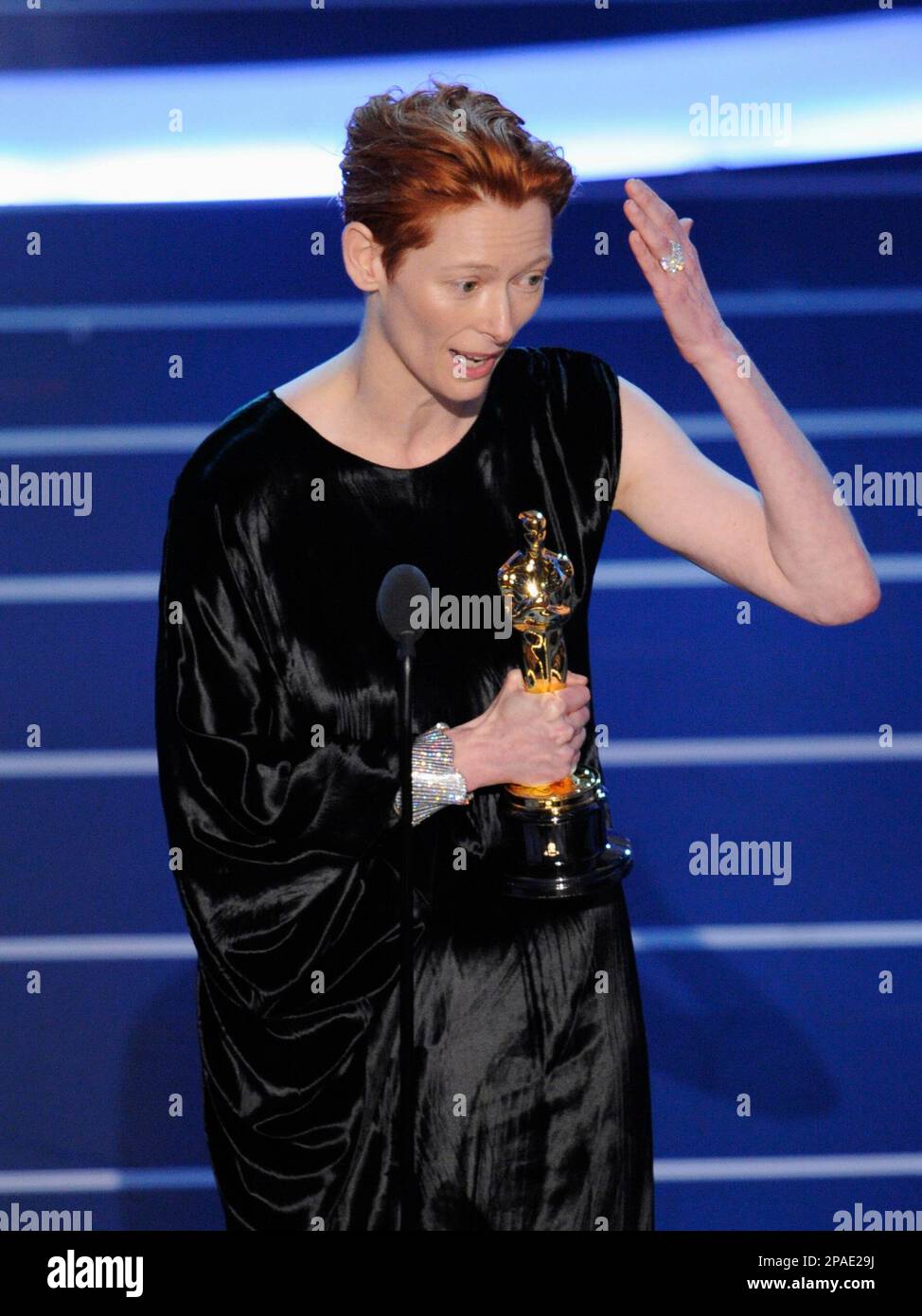 British actress Tilda Swinton accepts the Oscar for best supporting ...