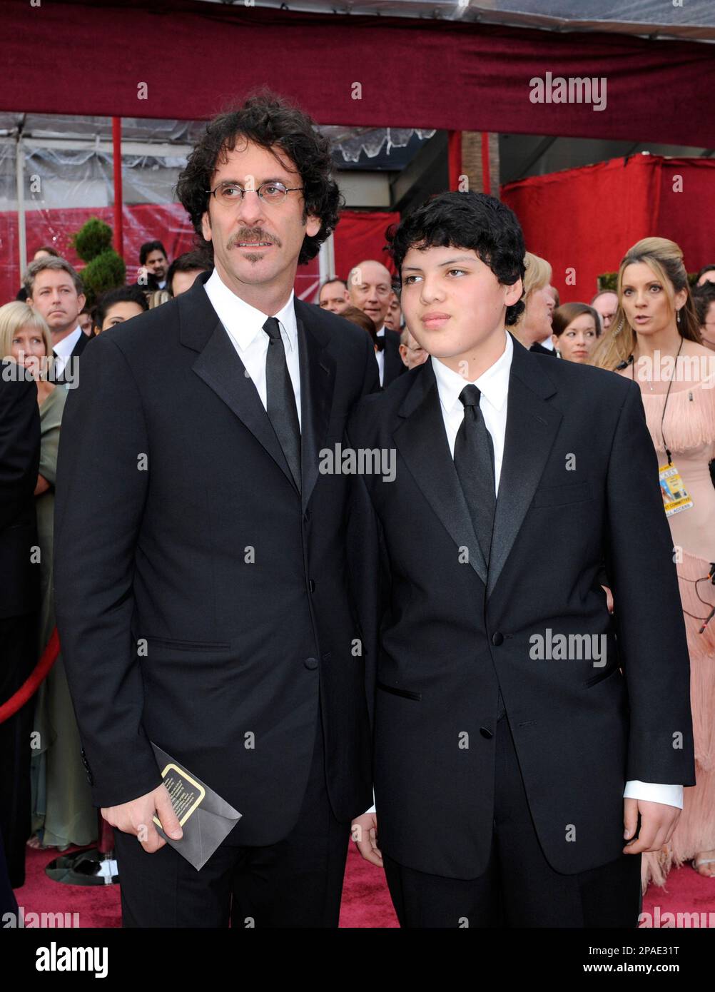 Director Joel Coen, left, arrives with his son Pedro for the 80th ...