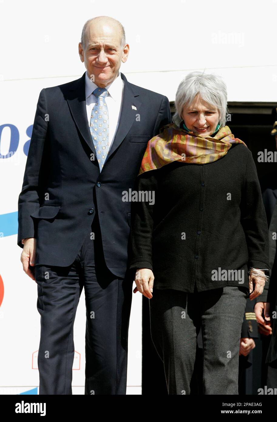 Israeli Prime Minister Ehud Olmert, left, and his wife Aliza step down ...