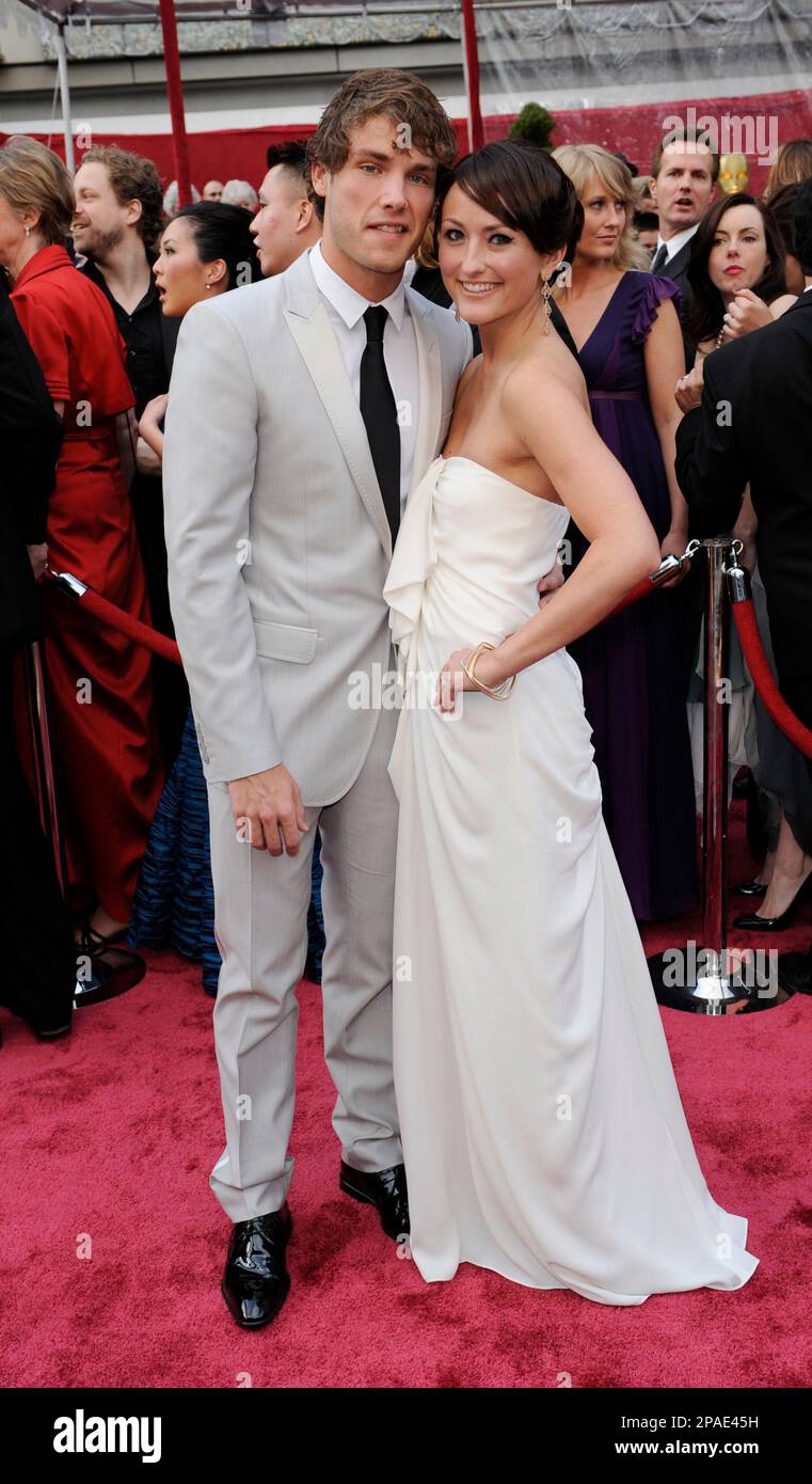 Singer Jon McLaughlin, left, arrives with an unidentified guest for the ...