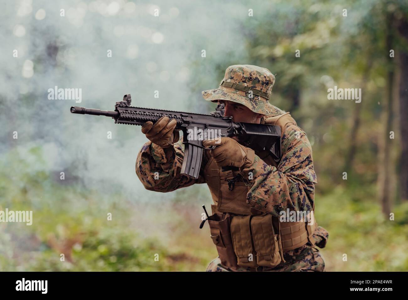 A modern warfare soldier on war duty in dense and dangerous forest ...