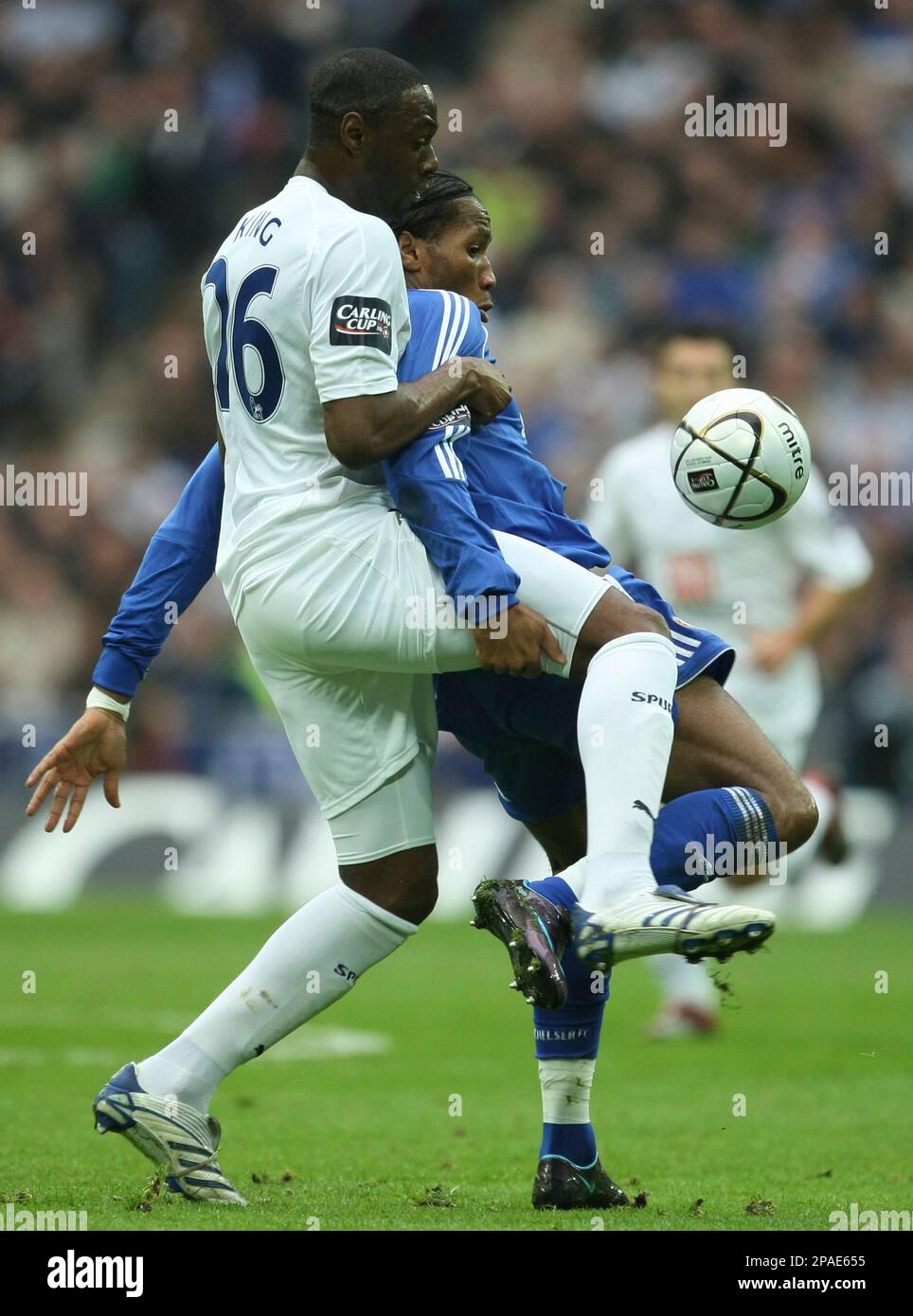Chelsea's Didier Drogba, right, goes for the ball with Tottenham ...