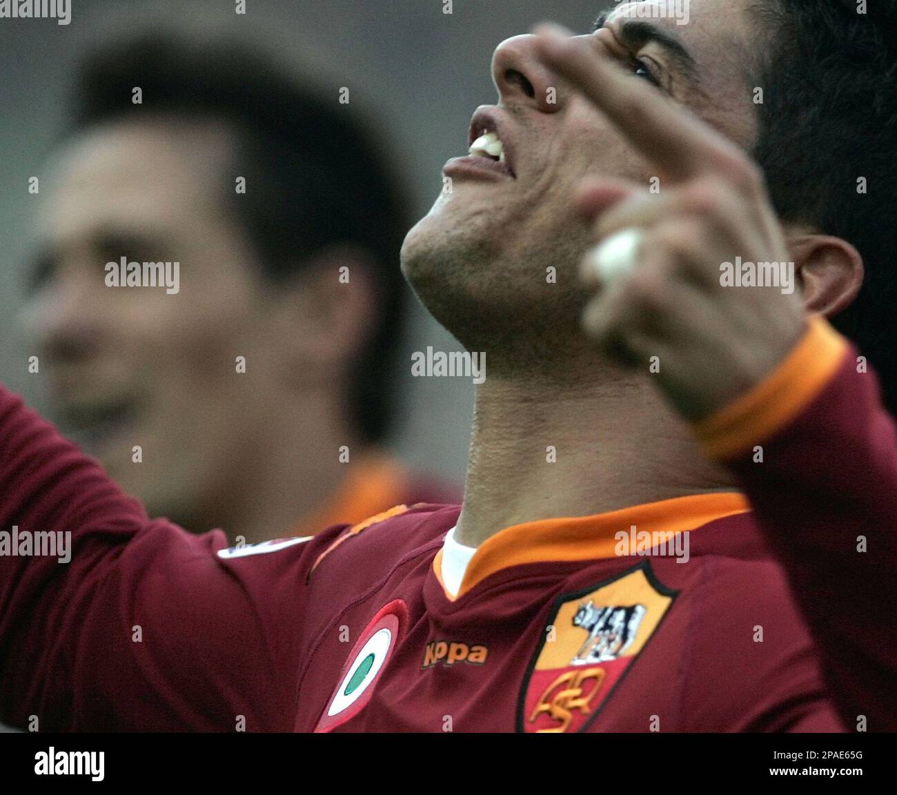 AS Roma's Cicinho, right, celebrates after scoring, during the Italian ...