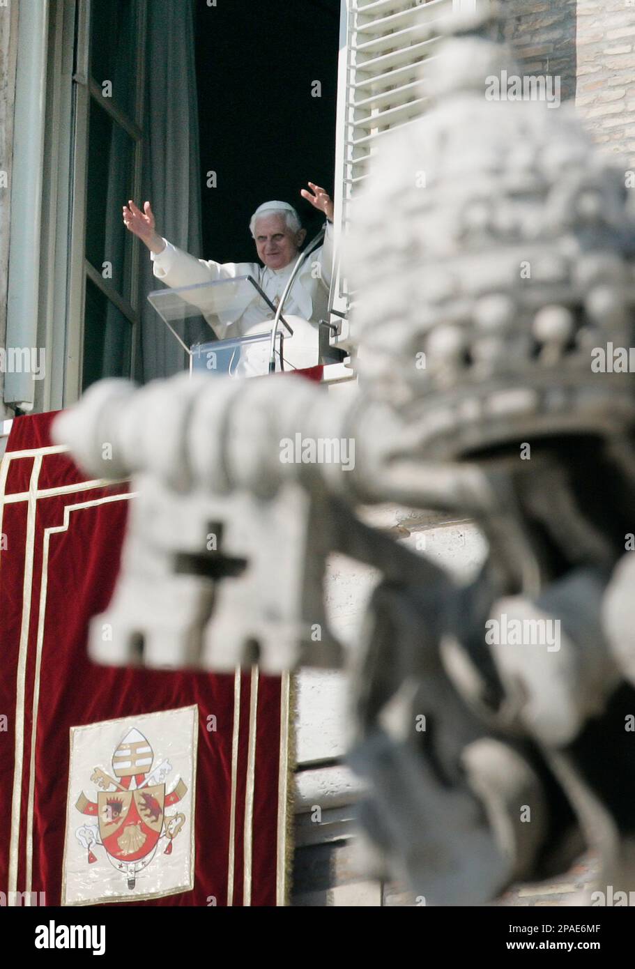 Pope Benedict XVI greets the faithful during the Angelus prayer in St ...