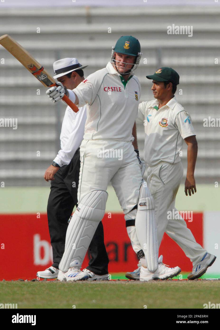 South Africa's Graeme Smith raises his bat after completing fifty runs ...