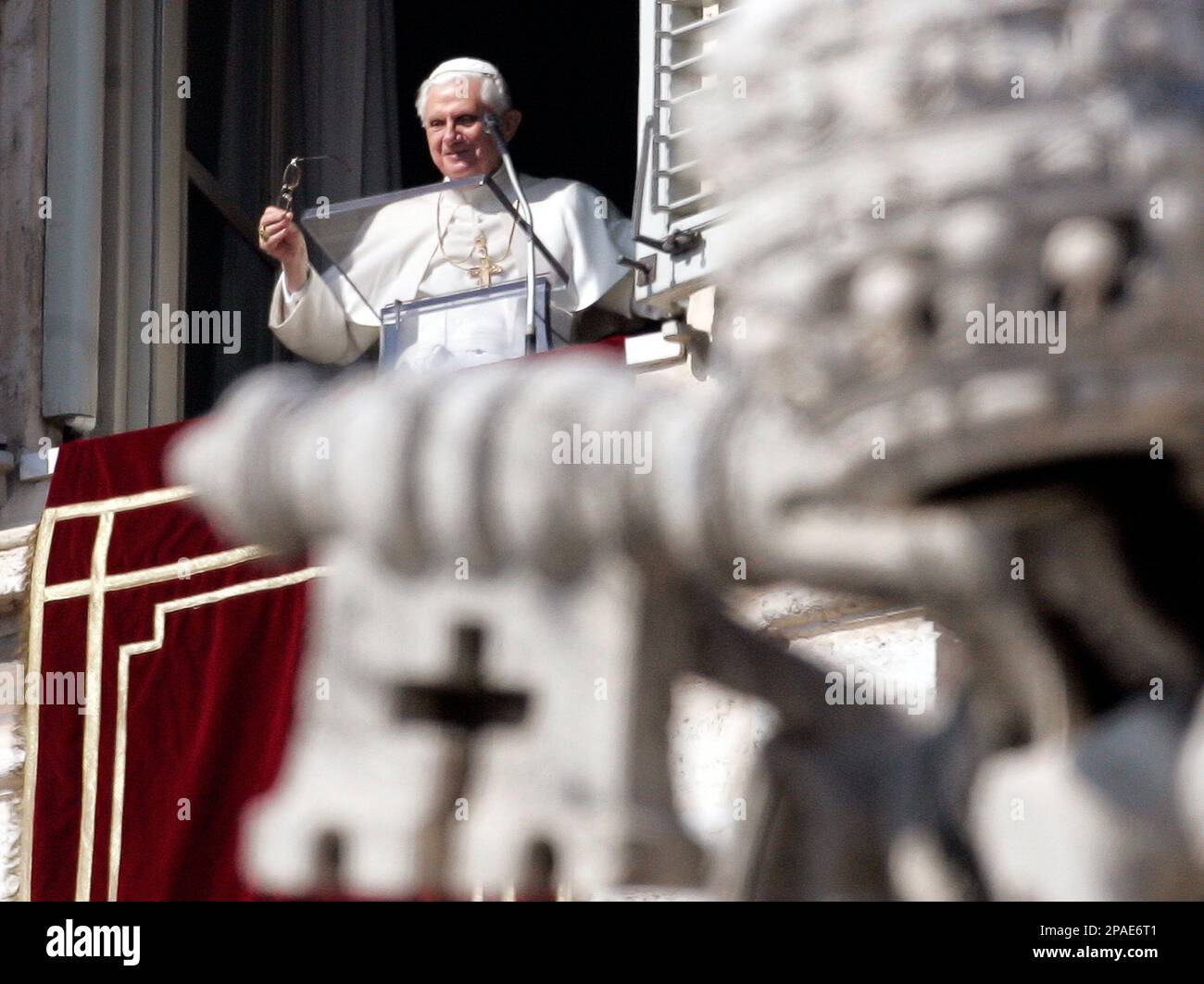 Pope Benedict XVI greets the faithful during the Angelus prayer in St ...